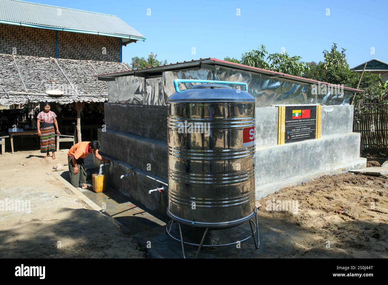 Nay Pyi Taw, Myanmar. 27th Dec, 2024. A villager collects water from a ...