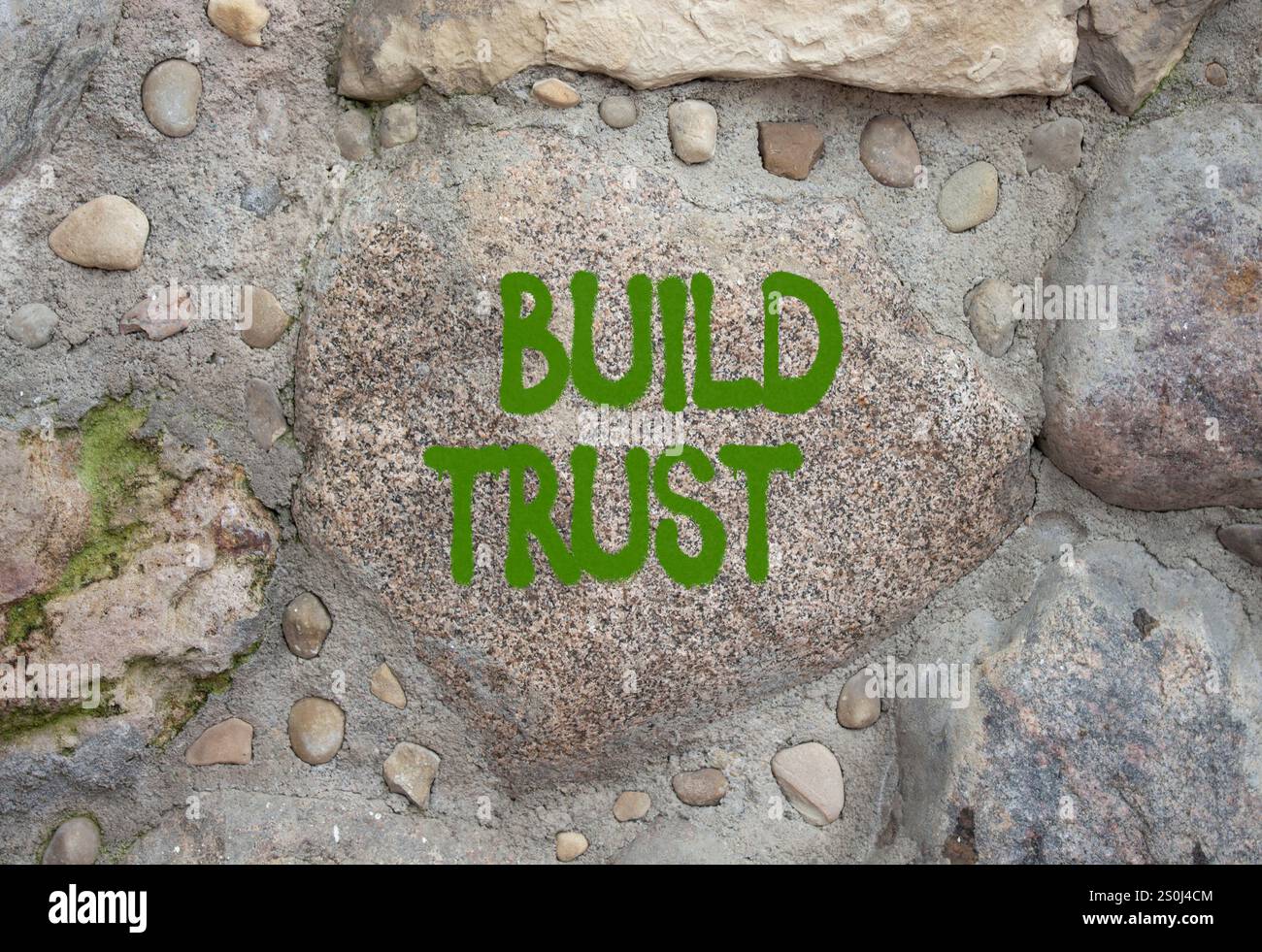 Build trust symbol. Stone wall with words Build trust. Beautiful stone ...