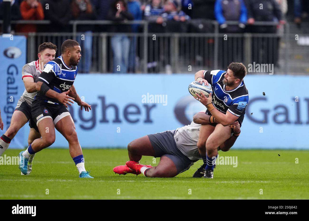 Bath's Francois van Wyk is tackled by Saracens' Eroni Mawi during the ...