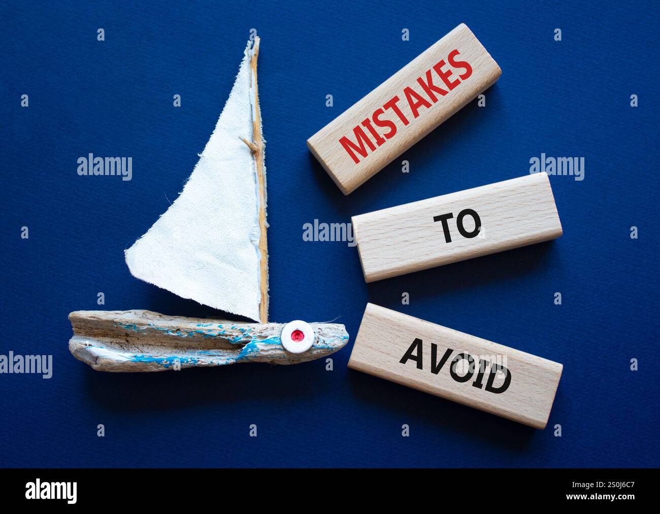Mistakes to Avoid symbol. Wooden blocks with words Mistakes to Avoid ...