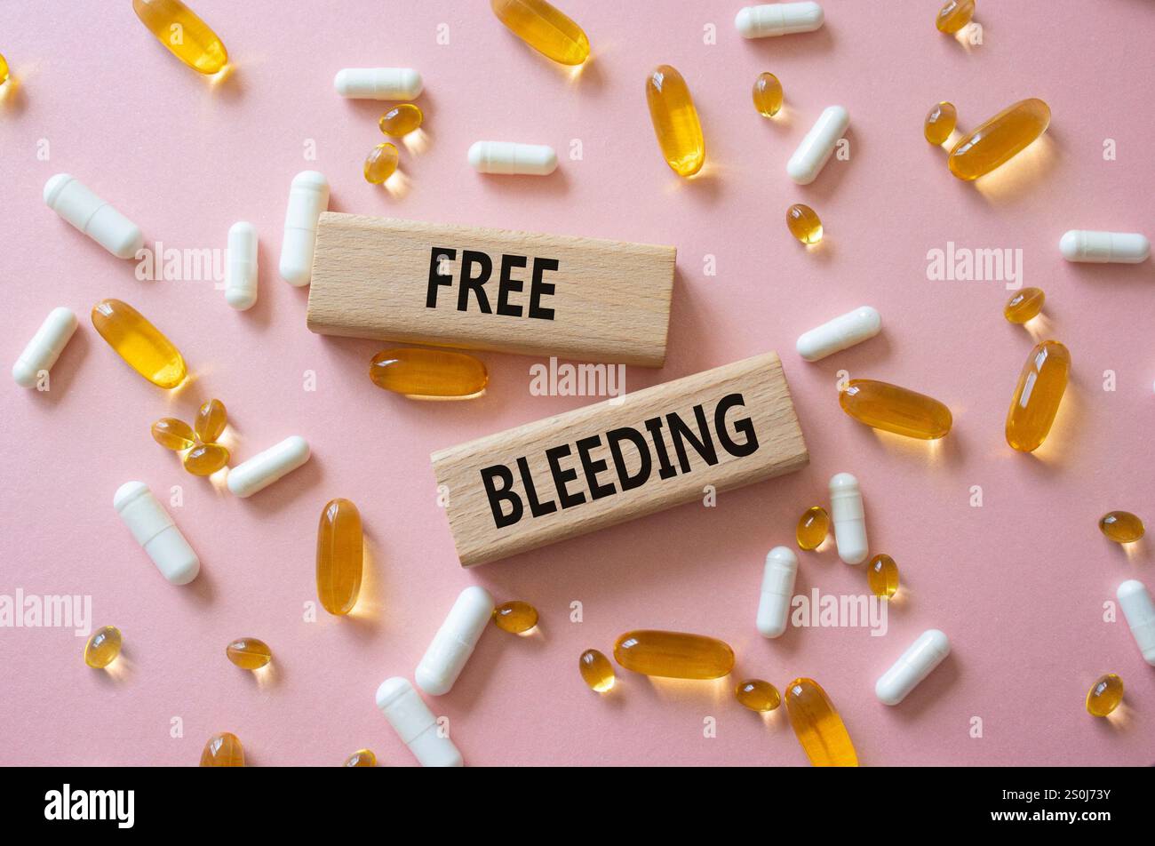 Free bleeding symbol. Concept words Free bleeding on wooden blocks ...