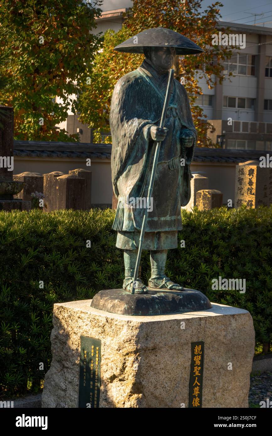 statue of Shinran Shonin a Japanese Buddhist monk near a cemetery in ...