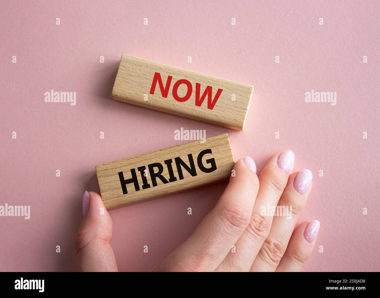 Now Hiring symbol. Concept word Now Hiring on wooden blocks ...