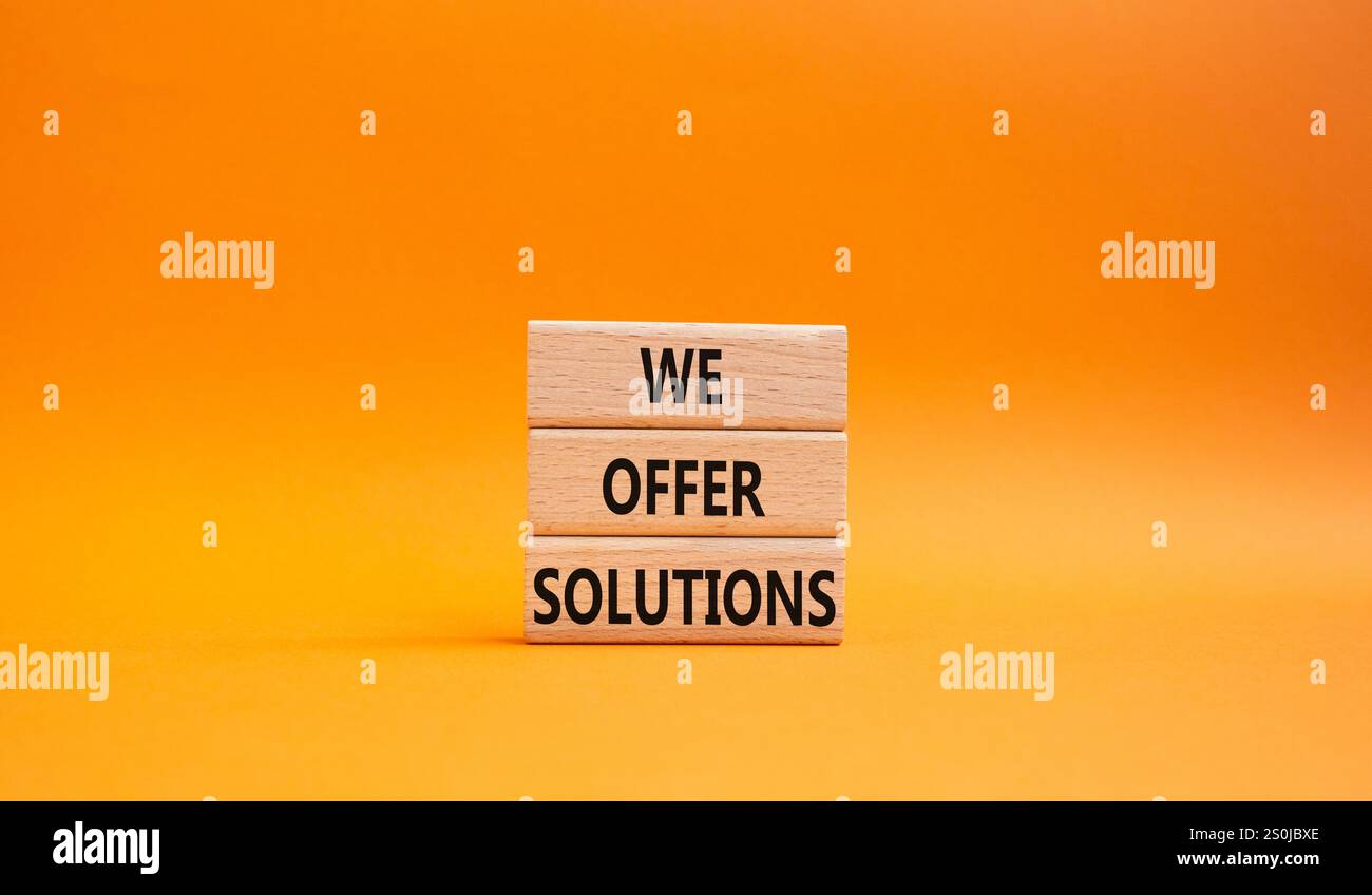 We offer solutions symbol. Concept words We offer solutions on wooden ...