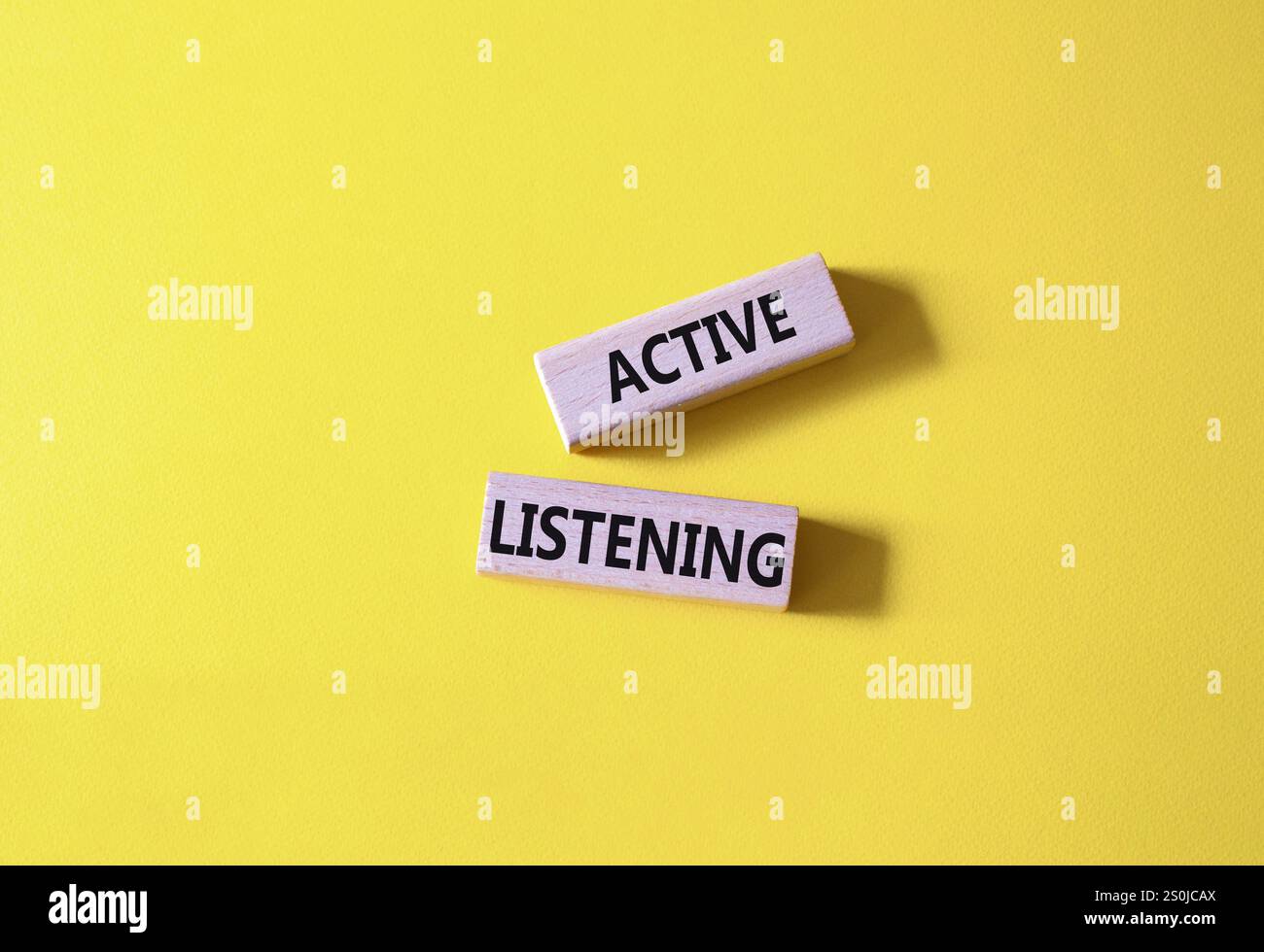 Active listening symbol. Wooden blocks with words Active listening ...