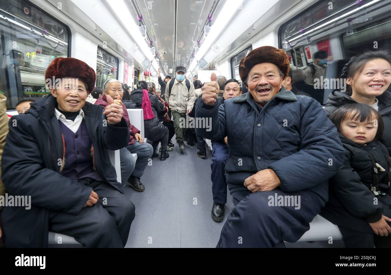 Guiyang, China's Guizhou Province. 28th Dec, 2024. People take a train ...