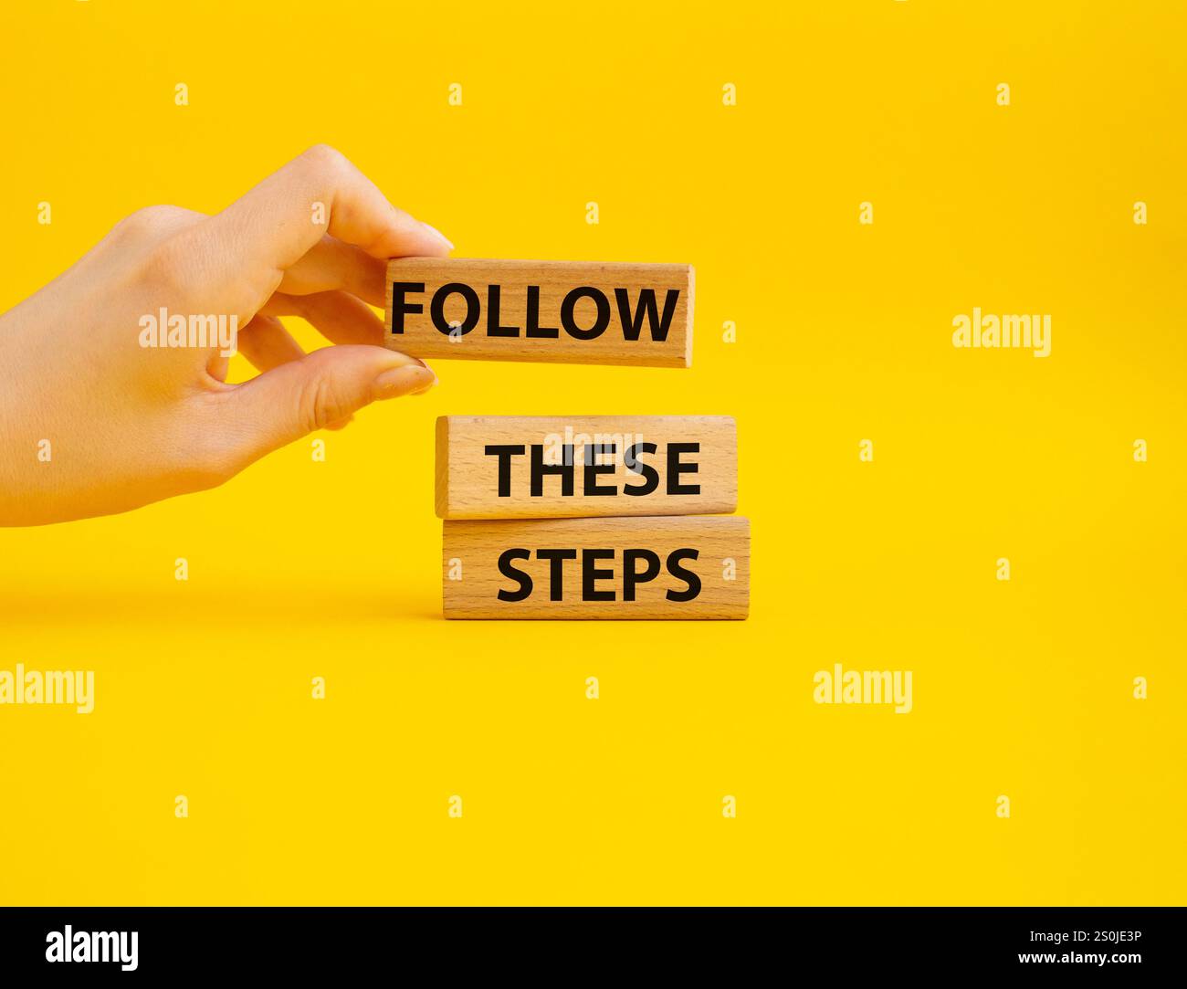 Follow these steps symbol. Wooden blocks with words Follow these steps ...