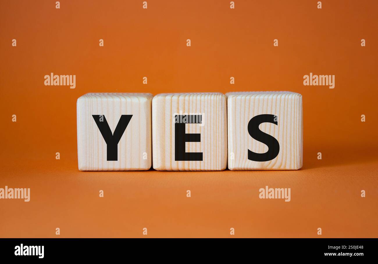 Yes symbol. Wooden blocks with word yes. Beautiful orange background. Business and yes concept ...