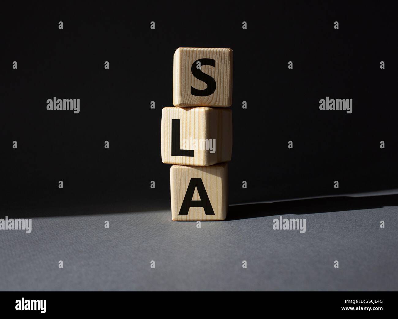 SLA - Service Level Agreement. Wooden cubes with word SLA. Beautiful ...