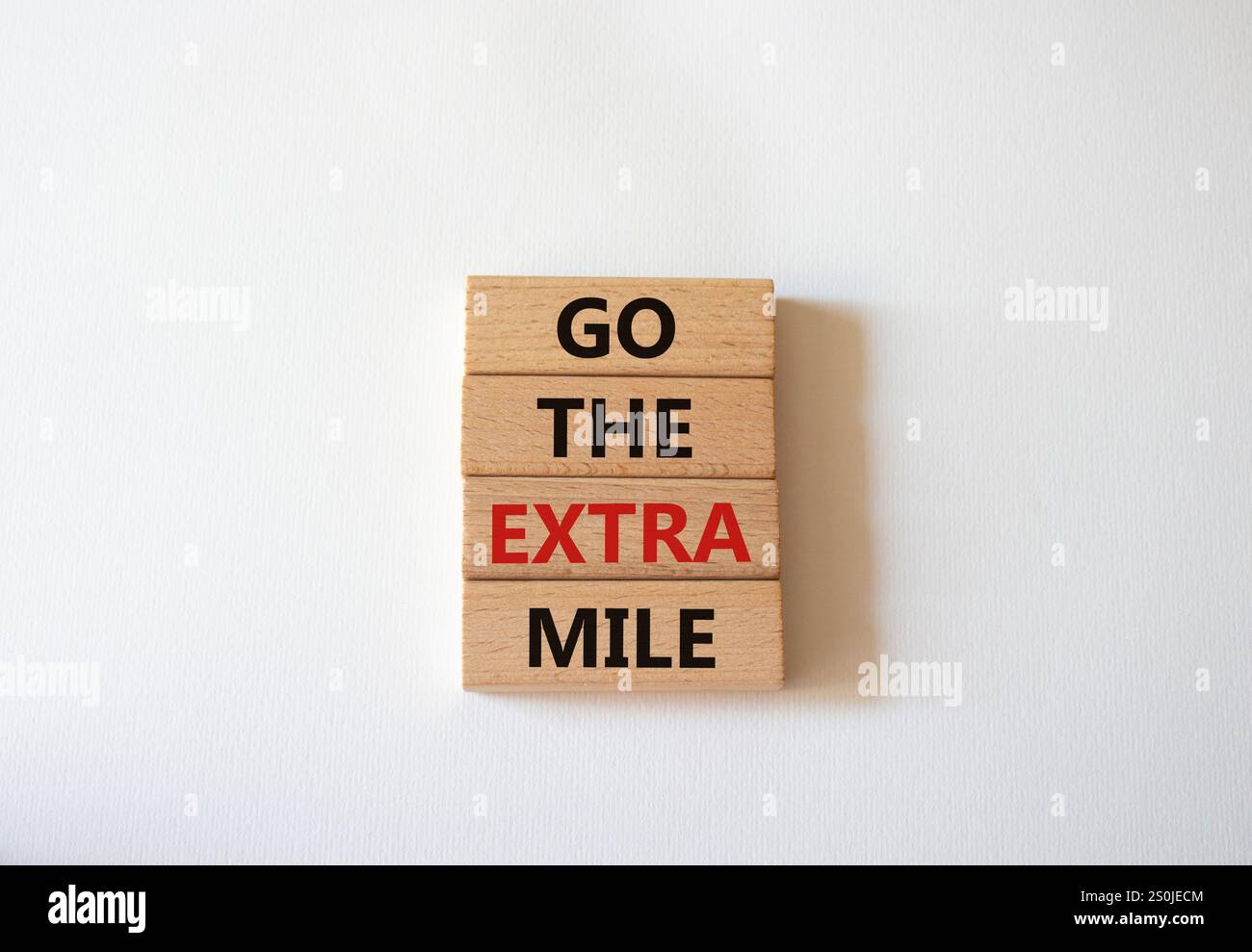 Go the extra mile symbol. Wooden blocks with words Go the extra mile ...