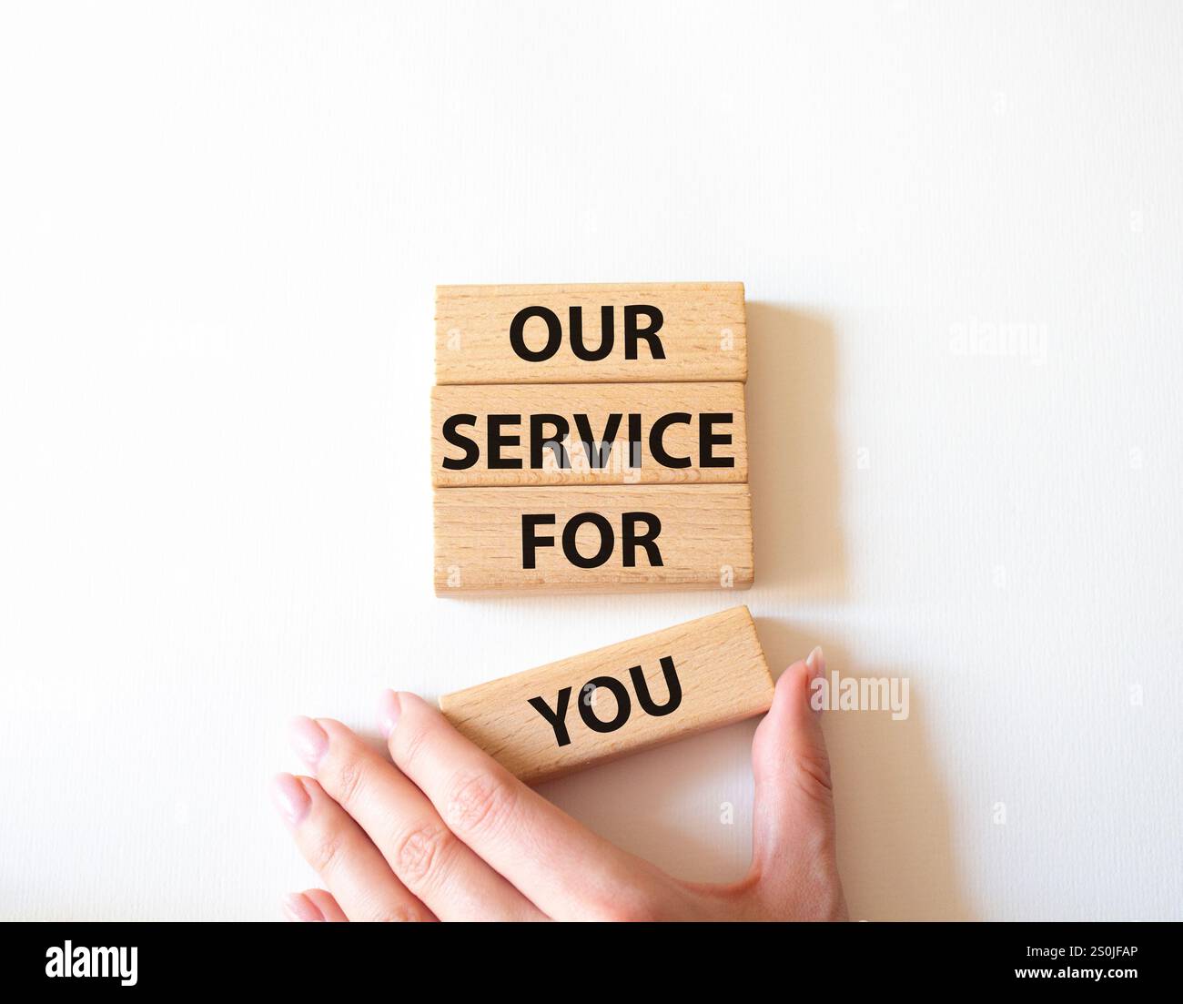 Our service for you symbol. Wooden blocks with words Our service for ...