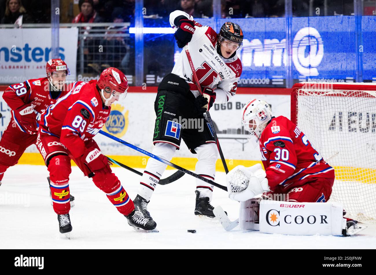 241228 Örebros Milton Oscarson och Timrås målvakt Jacob Johansson under ...