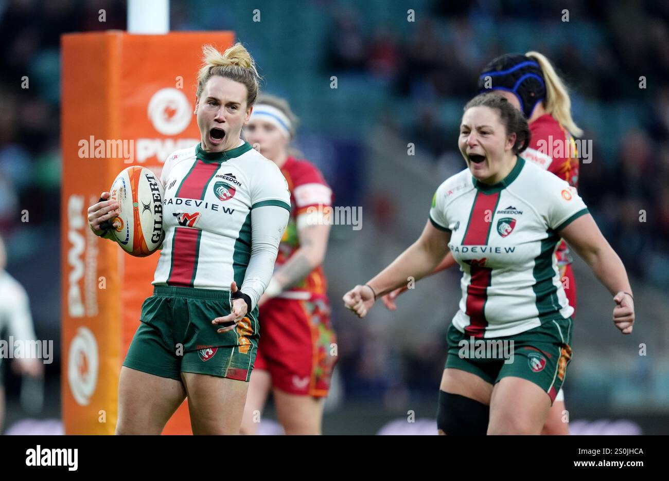 Leicester Tigers' Meg Jones (left) celebrates after scoring her sides ...