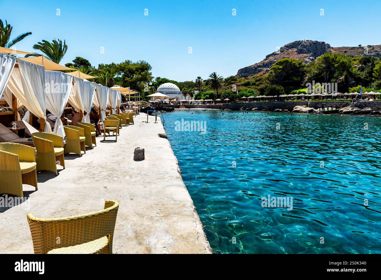 Rhodes, Greece July 7, 2024: Beach within the thermal springs Kallithea ...