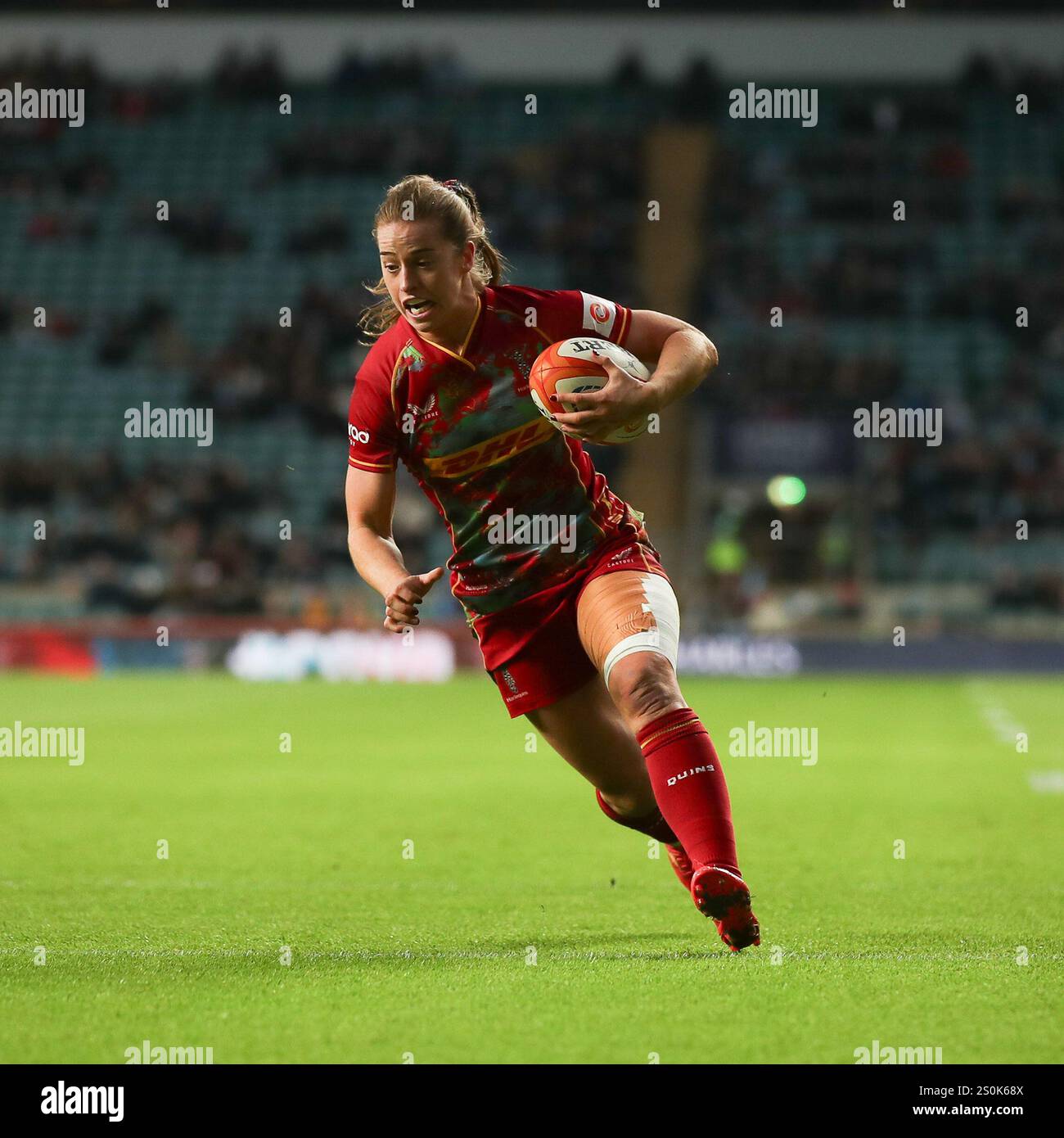 Twickenham, UK. 28th Dec, 2024. Lisa Neumann of Harlequins Women scores ...