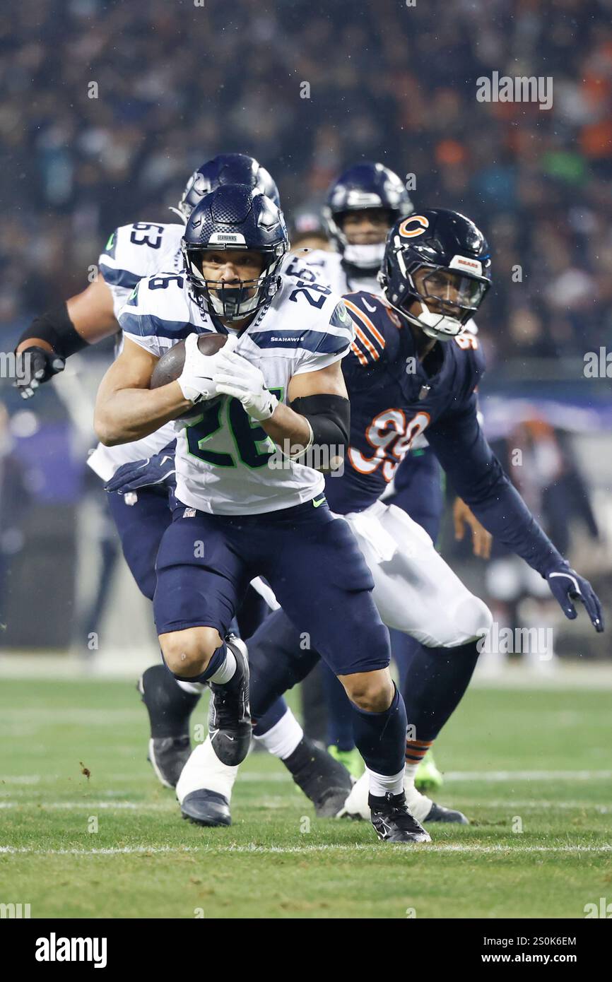 Seattle Seahawks running back Zach Charbonnet (26) runs with the ball ...