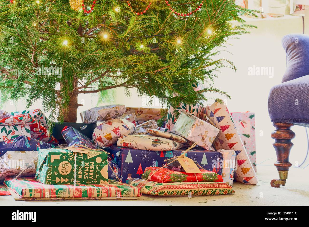 Christmas presents under the tree Stock Photo - Alamy