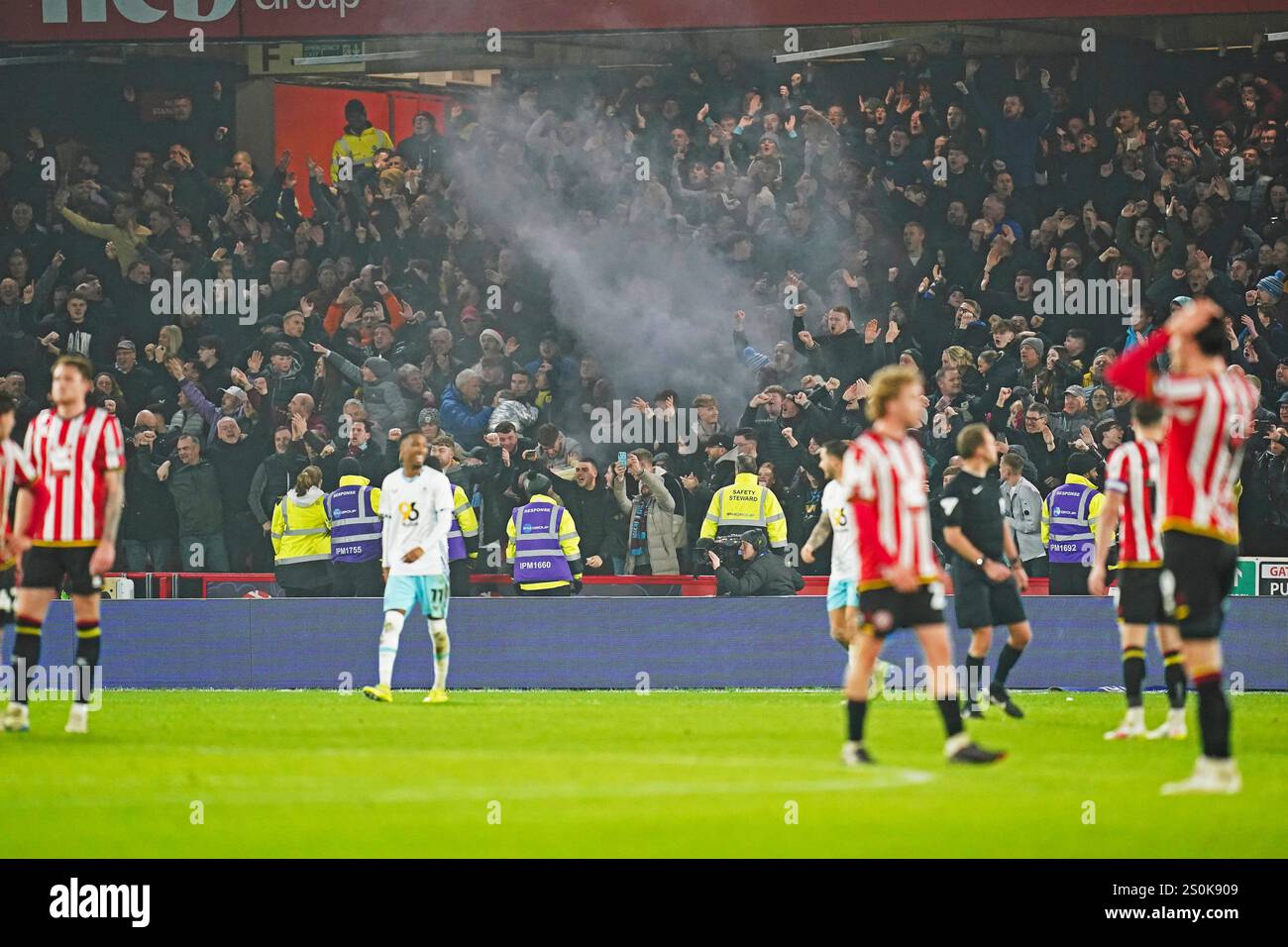 Burnley FC fans set off a flare after Burnley FC forward Zian Flemming ...