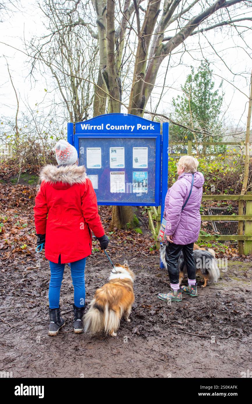 People walking dogs on the Wirral Way footpath, The Wirral Way is a ...
