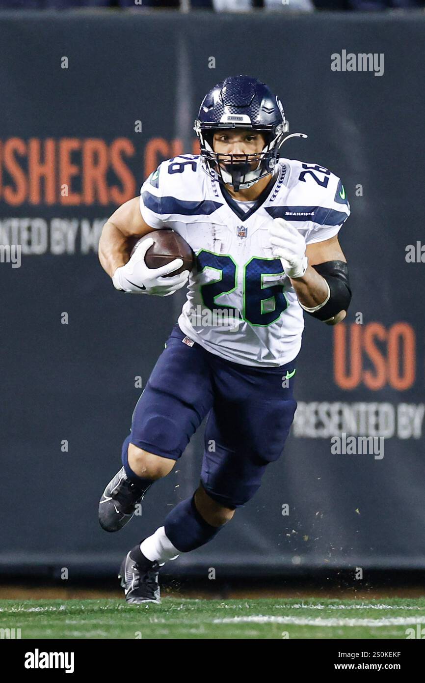 Seattle Seahawks running back Zach Charbonnet (26) runs with the ball ...