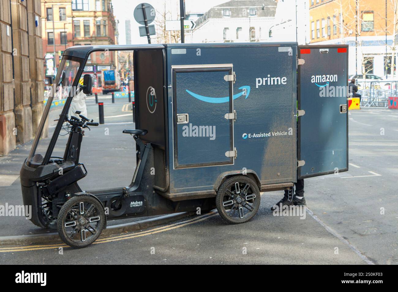 Amazon Prime e-assisted delivery vehicle parked on an urban street ...
