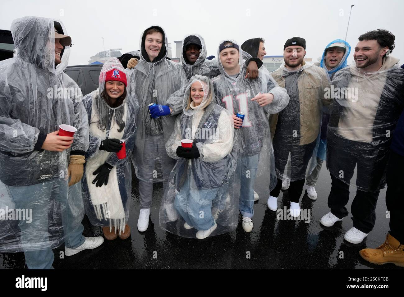 Fans tailgate in the rain prior to an NFL football game, Saturday, Dec ...