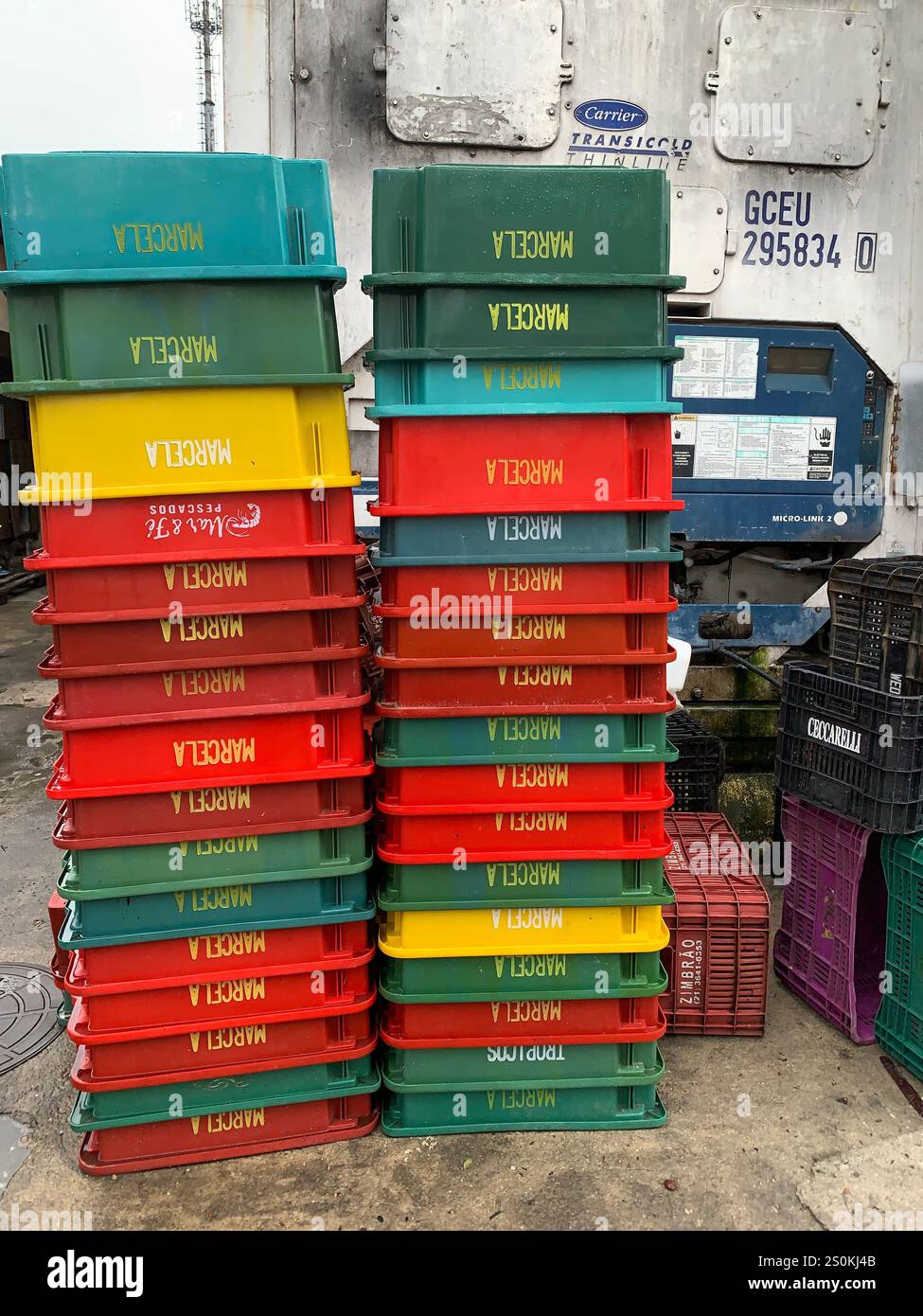 Two piles of colorful plastic empty food crates up side down Stock ...
