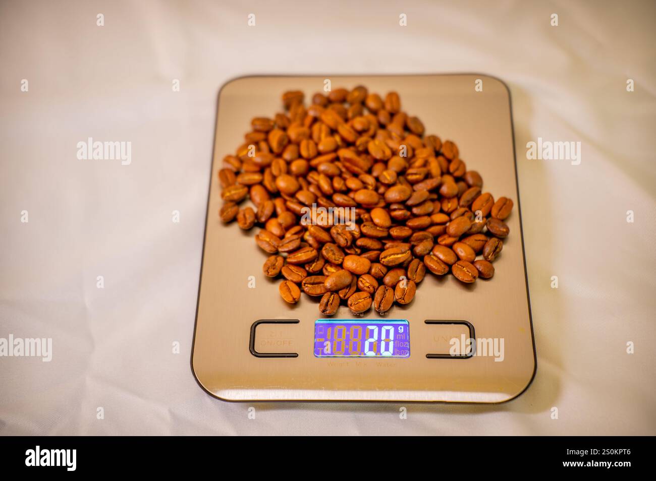 Coffee beans on scale Stock Photo - Alamy