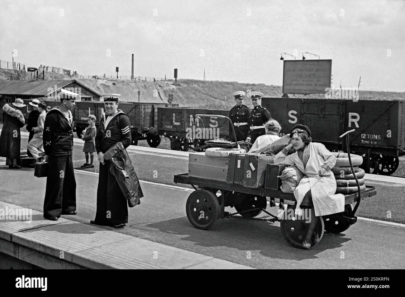 Bournemouth Station with two sailors, and languishing station porter ...