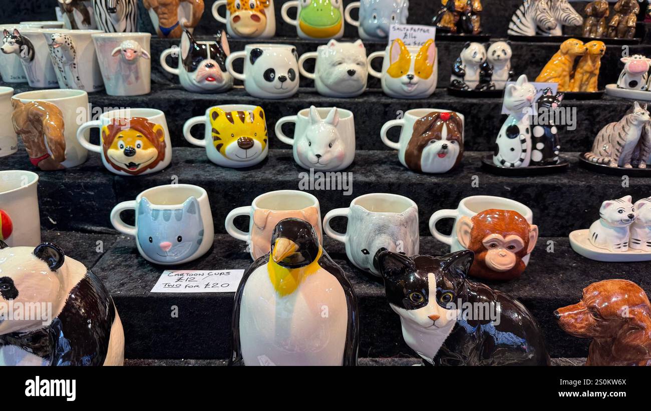 A display of ceramic mugs and salt and pepper shakers featuring various ...