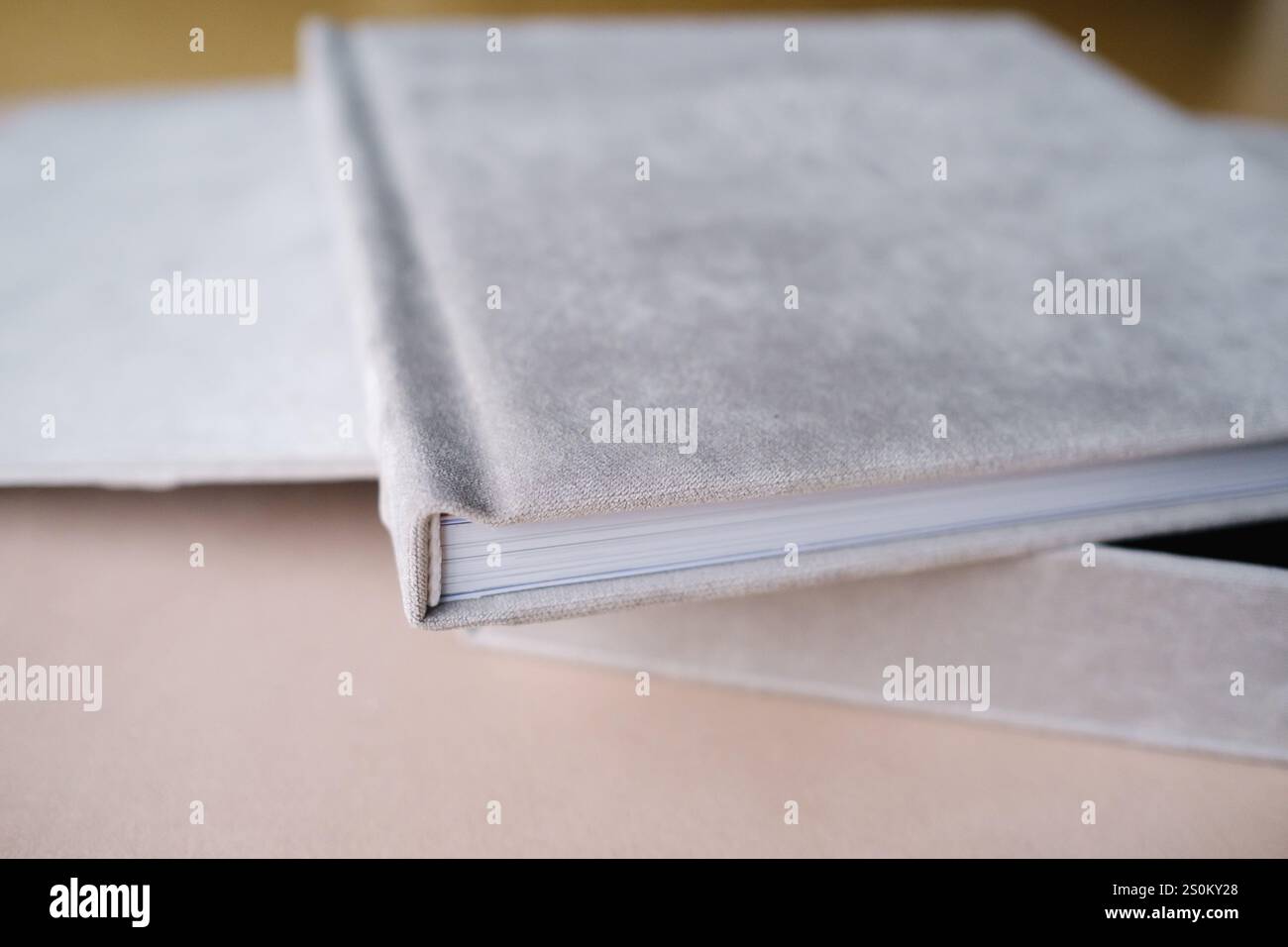 The photo book is grey in a soft cloth cover. the concept of creating ...