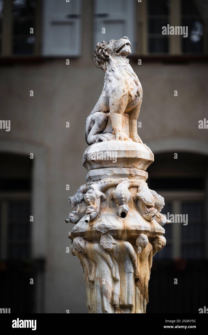 Sculpture of a lion and gargoyle on the column in the fountain on the ...