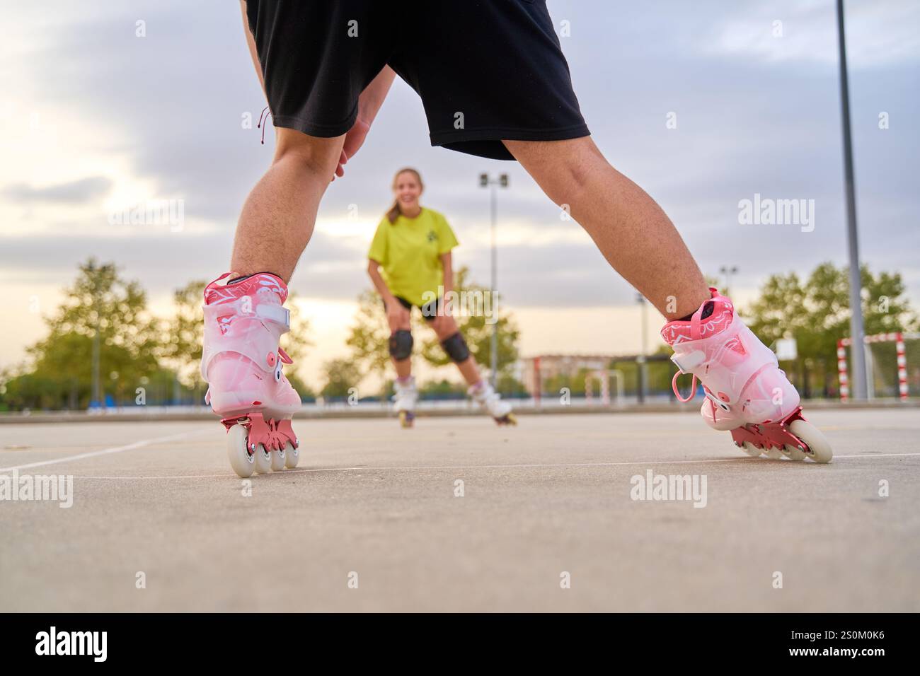 Instructor teaching skating techniques in a group Stock Photo - Alamy