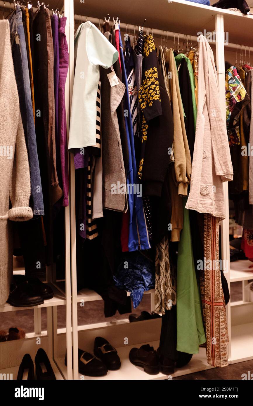 Pants hanging on hangers hi-res stock photography and images - Alamy