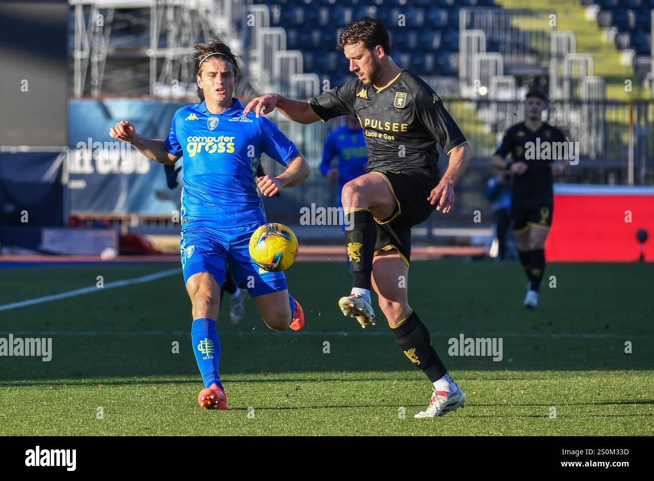 Empoli, Italy. 28th Dec, 2024. Aaron Martin (Genoa) hampered by Lorenzo ...