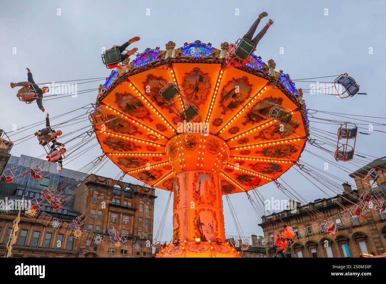 Fairground roundabout ariel swing in Christmas Winterfest carnival ...