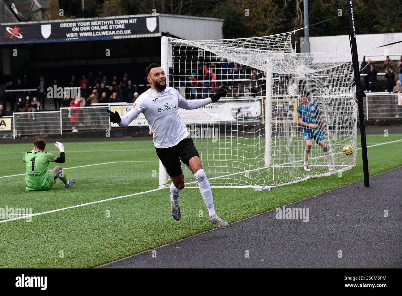 Kane Simpson of Merthyr Town celebrates after he scores his teams 2nd ...
