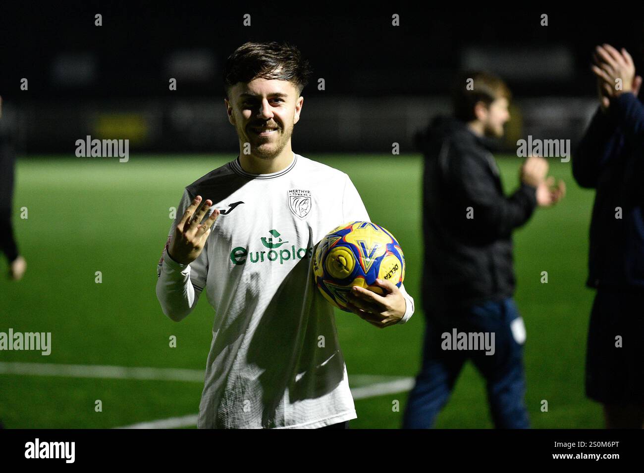 Lewys Twamley of Merthyr Town celebrates with the match ball after the ...