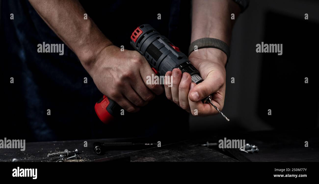 Holds drill in hands hi-res stock photography and images - Alamy