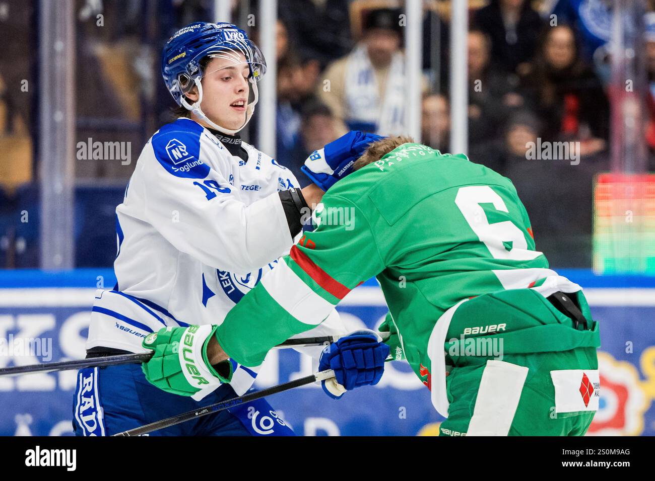 Leksand, Sverige. 28th Dec, 2024. 241228 Leksands Anton Johansson och Rögles Carter Ashton under ...