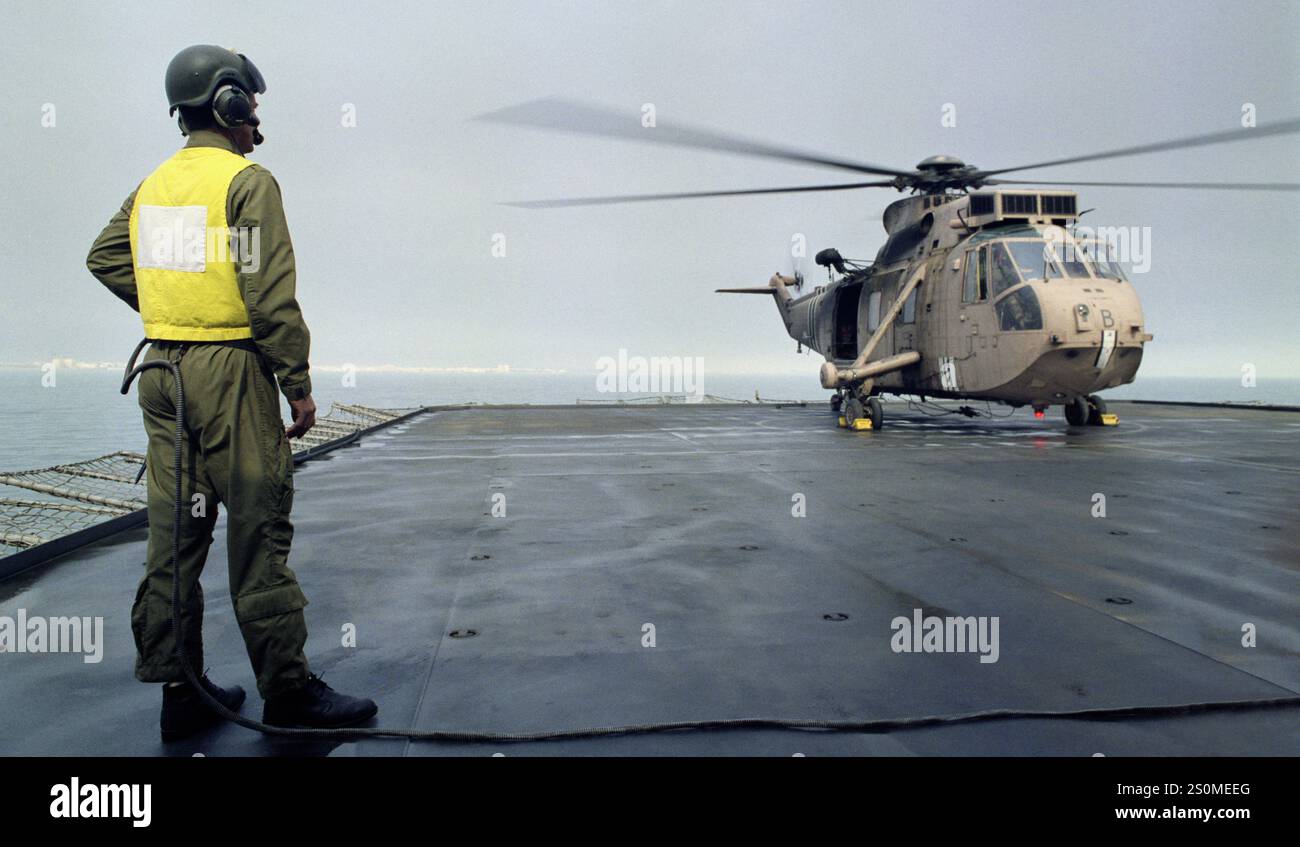 First Gulf War: 20th March 1991 An aircraft handler stands ready as an ...