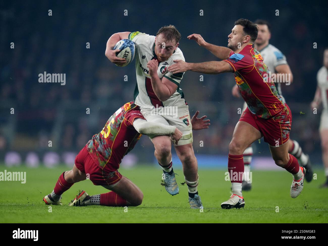 Leicester Tigers' Tommy Reffell (centre) is tackled by Harlequins' Nick ...