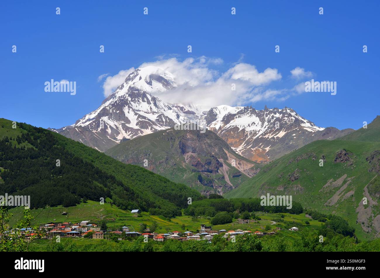 Mountain village at the foot of Mount Kazbek. Caucasus mountains in the ...