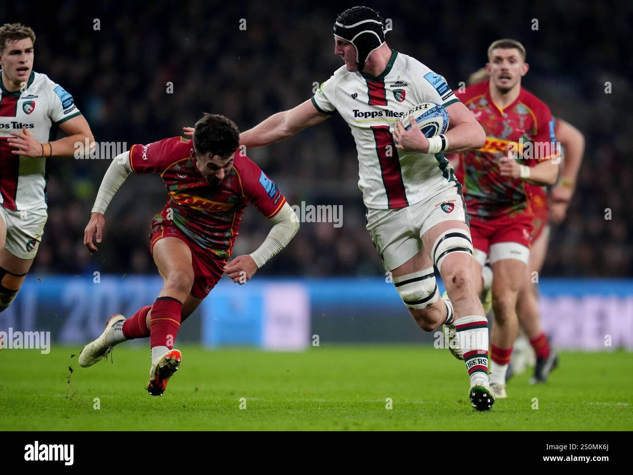 Leicester Tigers' Cameron Henderson (right) is tackled by Harlequins ...