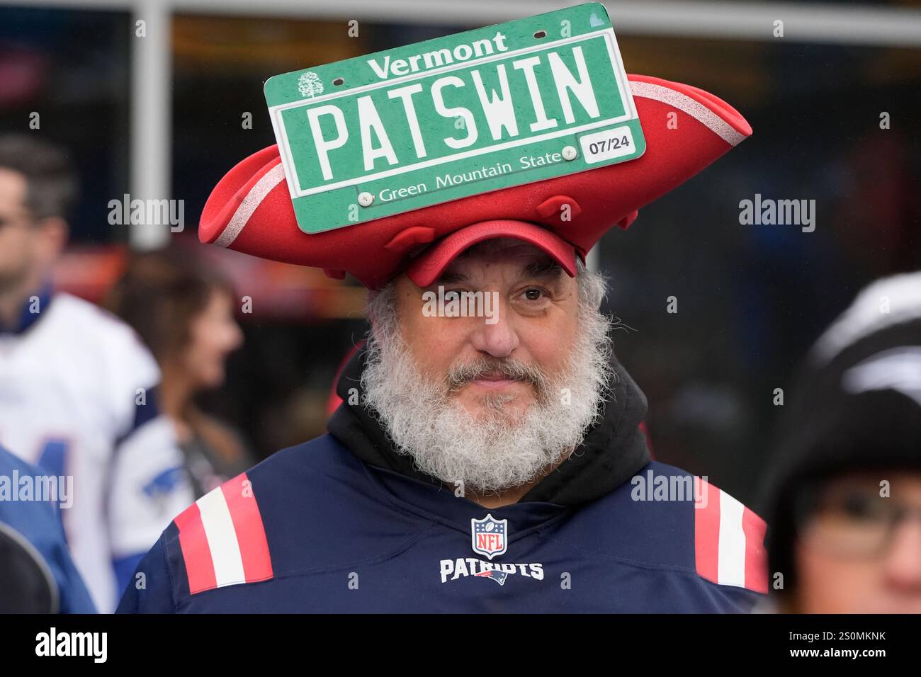 Patriots fan watches practice prior to an NFL football game, Saturday ...
