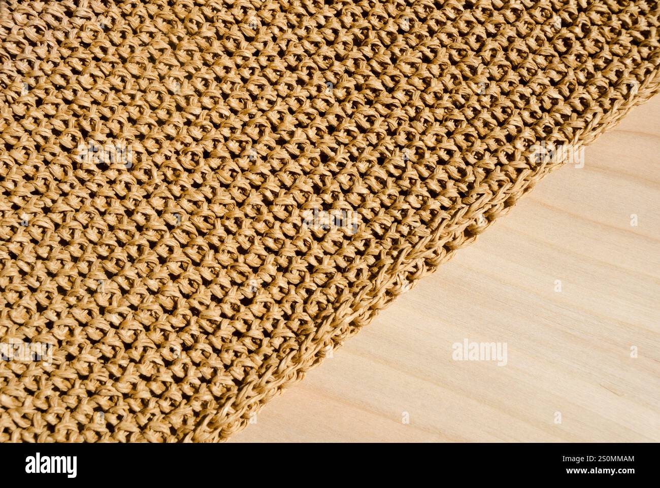 Crochet raffia pattern on wooden background Stock Photo - Alamy
