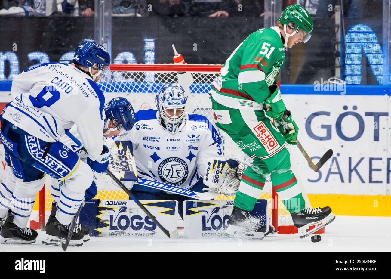 Leksand, Sverige. 28th Dec, 2024. 241228 Leksands målvakt Jakob Hellsten och Rögles Calle Själin ...