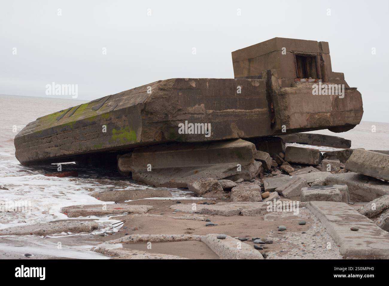 WW2 concrete military installations on beach Coastal erosion at Spurn ...