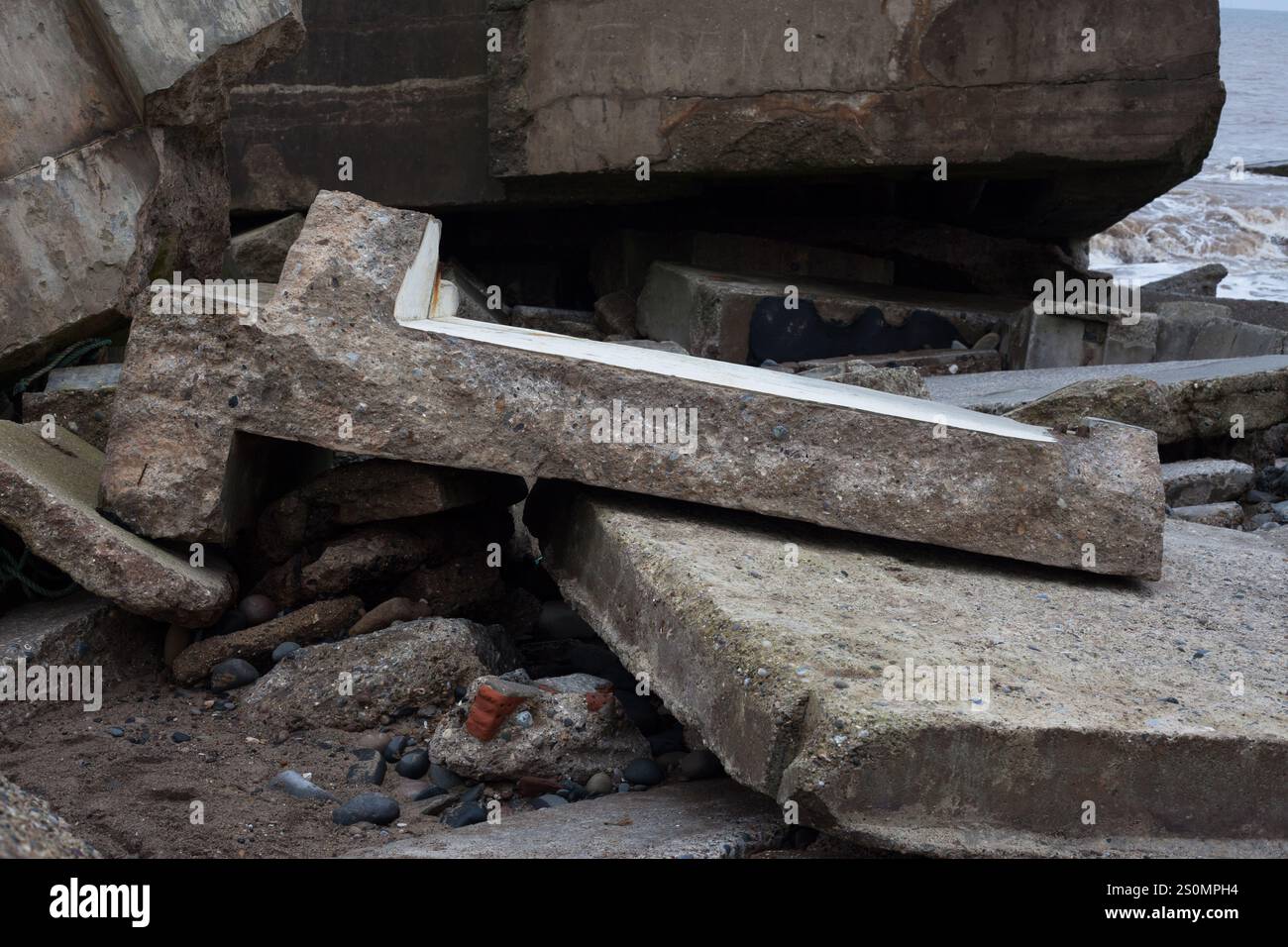 WW2 concrete military installations on beach Coastal erosion at Spurn ...