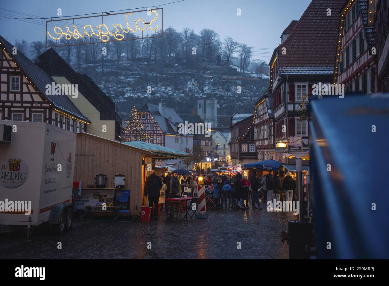 Evening Christmas market with half-timbered houses, illuminated stalls ...